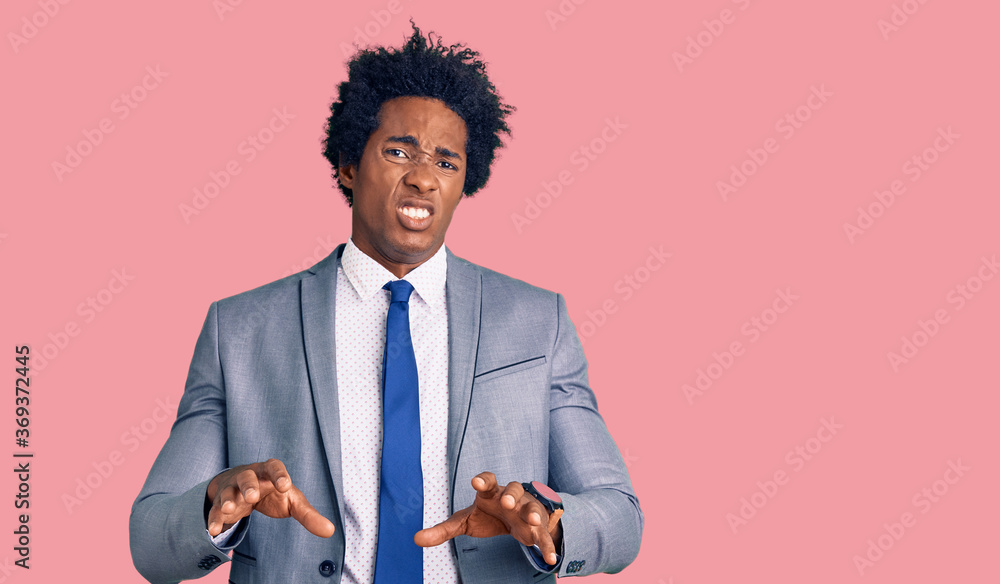 Handsome african american man with afro hair wearing business jacket ...