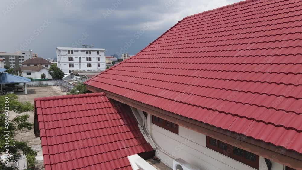 Red brown hacienda concrete roof tiles on big isolated house with ...