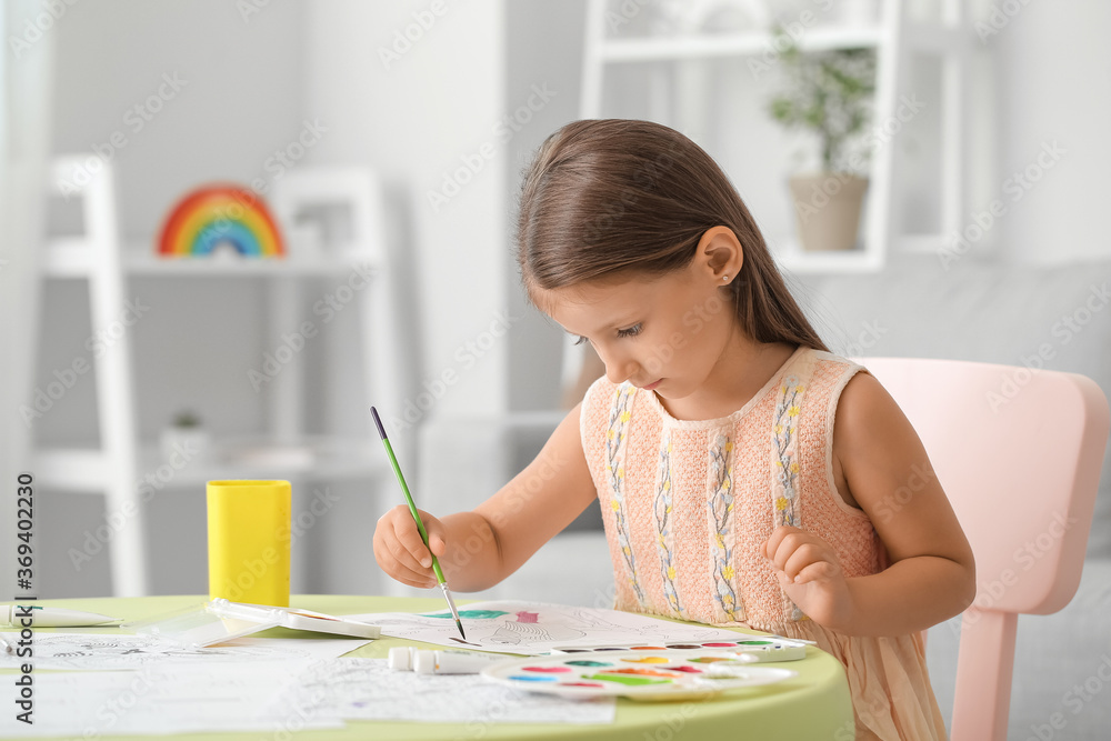 Cute little girl coloring pictures at home Stock Photo | Adobe Stock