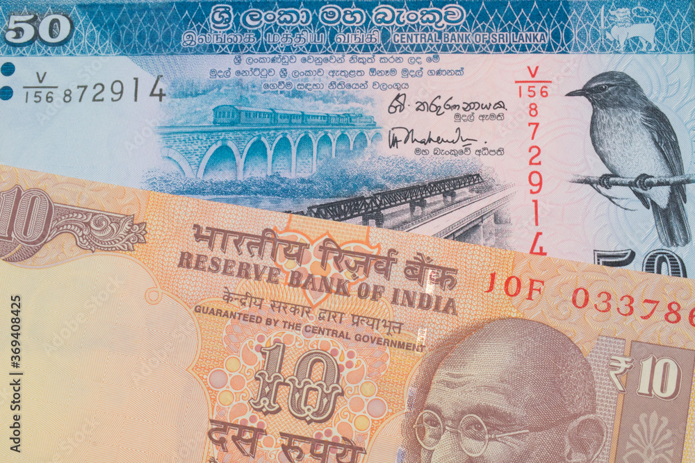 A macro image of a orange ten rupee bill from India paired up with a ...