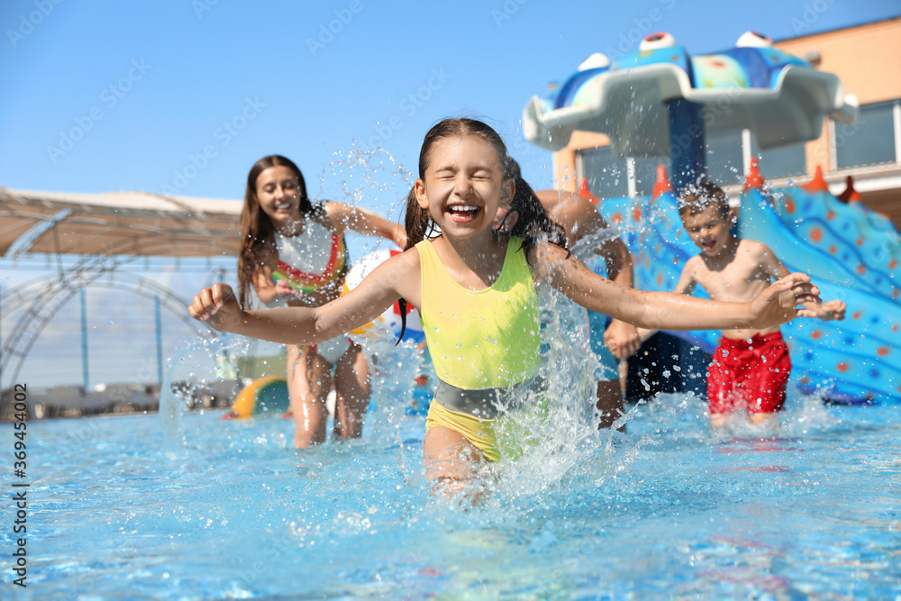 Happy family having fun at water park. Summer vacation Stock Photo ...