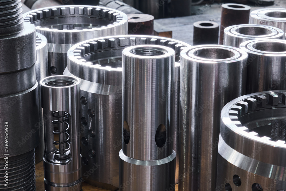 industrial background - new shiny steel hardware, parts of turbodrills ...