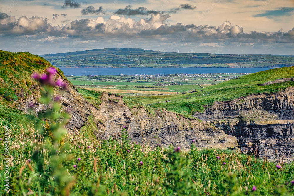 Irish landscape in summer. Cliffs of Moher and rural surroundings with ...