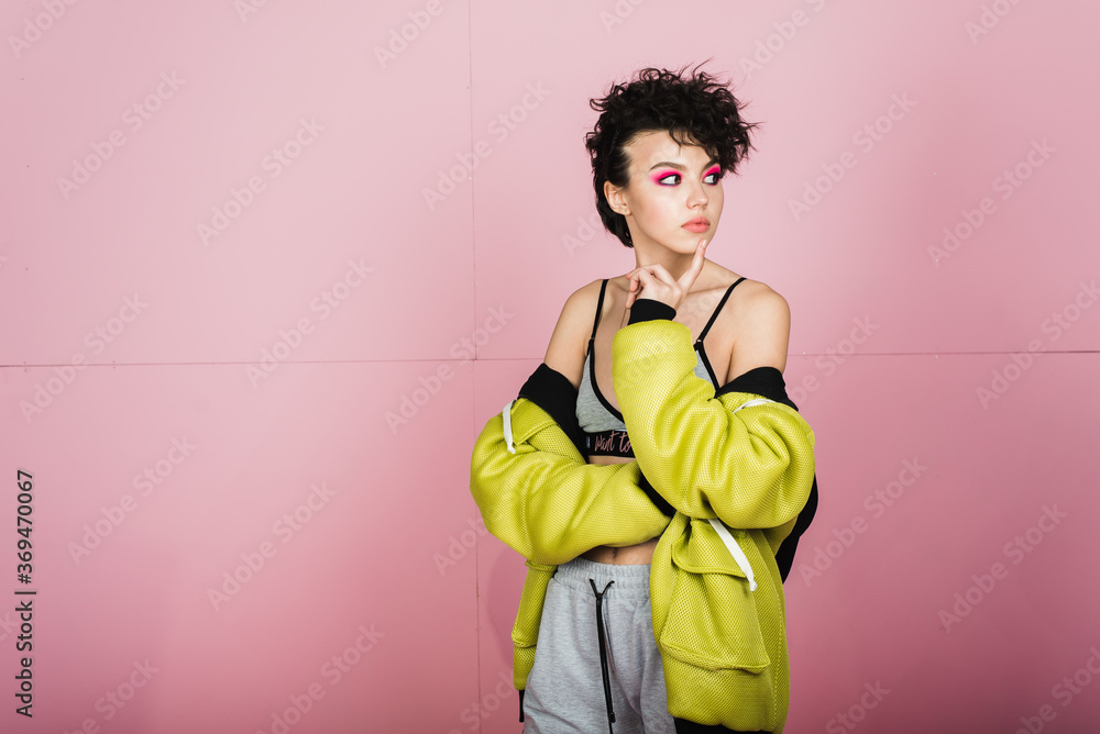 Beautiful teenager girl sincerely smiles and laughs in sports stylish ...