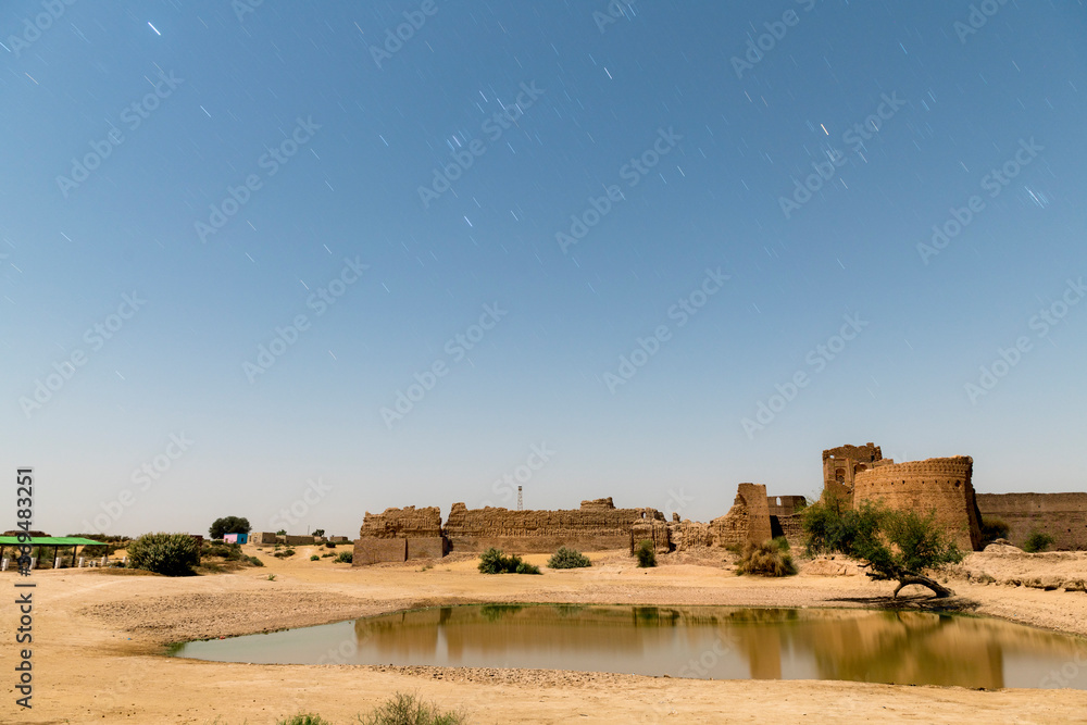 forts and historical buildings landscape at night with star trails and ...