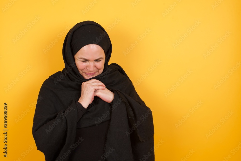 beautiful face of sad Middle aged muslim woman wearing black hijab ...