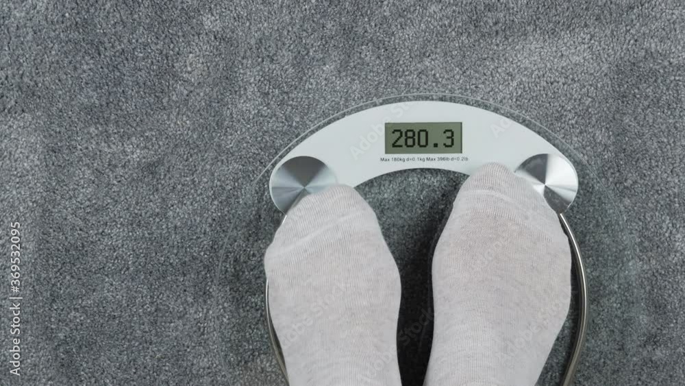 Overweight on a bathroom weight scale. HELP inscription on a digital ...