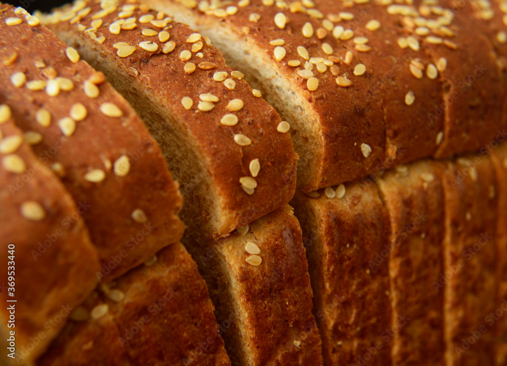 Fotografia do Stock: detalle de pan de caja con ajonjolí, rebanadas de ...