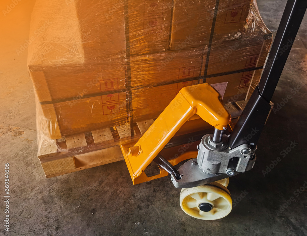 Worker driving forklift loading and unloading shipment carton boxes and ...
