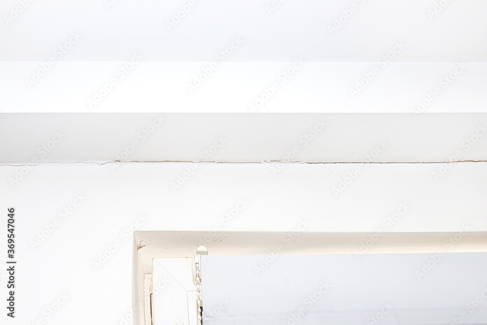Longitudinal crack in the lintel wall above the window inside the ...