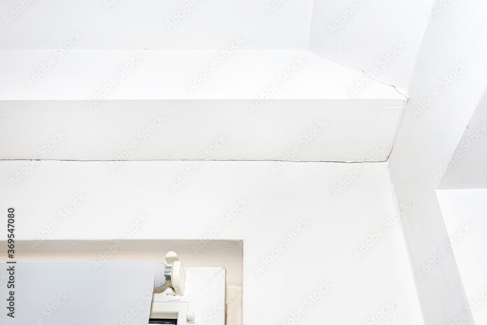 Longitudinal crack in the lintel wall above the window inside the ...