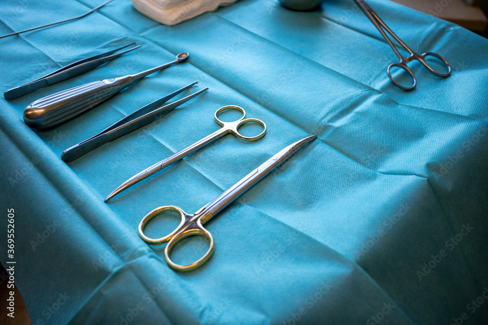 in operating room there is an instrument table with surgical ...