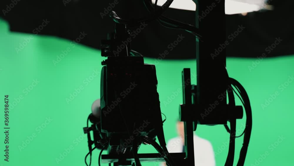 Film crew in green studio shooting video. Chroma - technology of ...