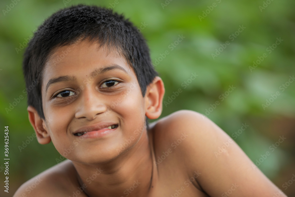 Happy indian child playing at ground Stock Photo | Adobe Stock
