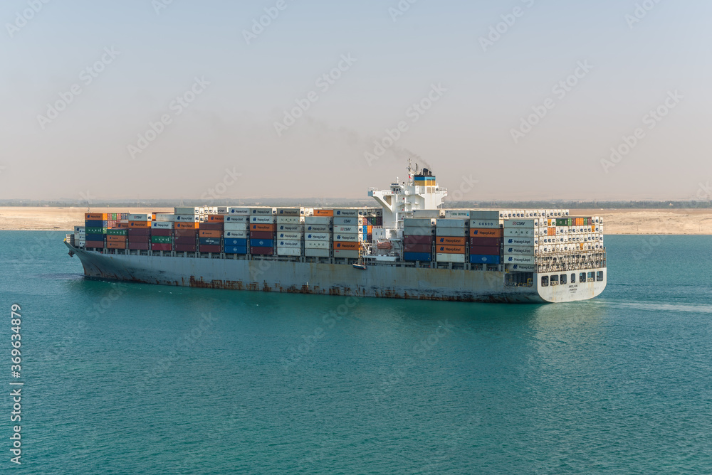 Suez, Egypt - November 14, 2019: Container vessel ship Amoliani passing ...
