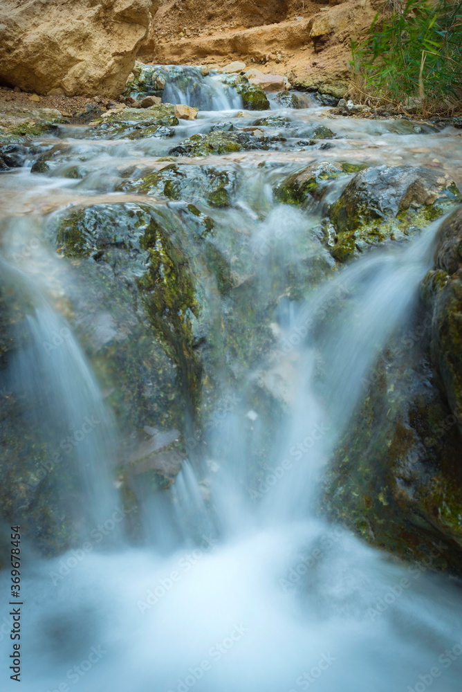 Desert waterfall in Ein Bokek river, canyon-like gorge with water ...