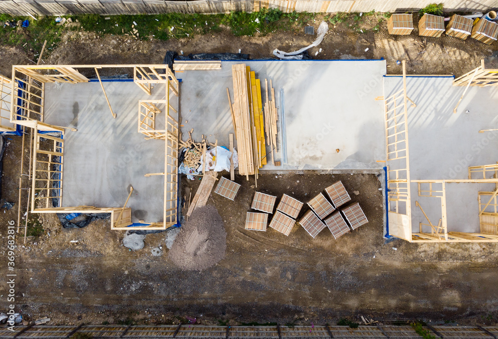 Early stages of construction, houses being build on the same lot ...