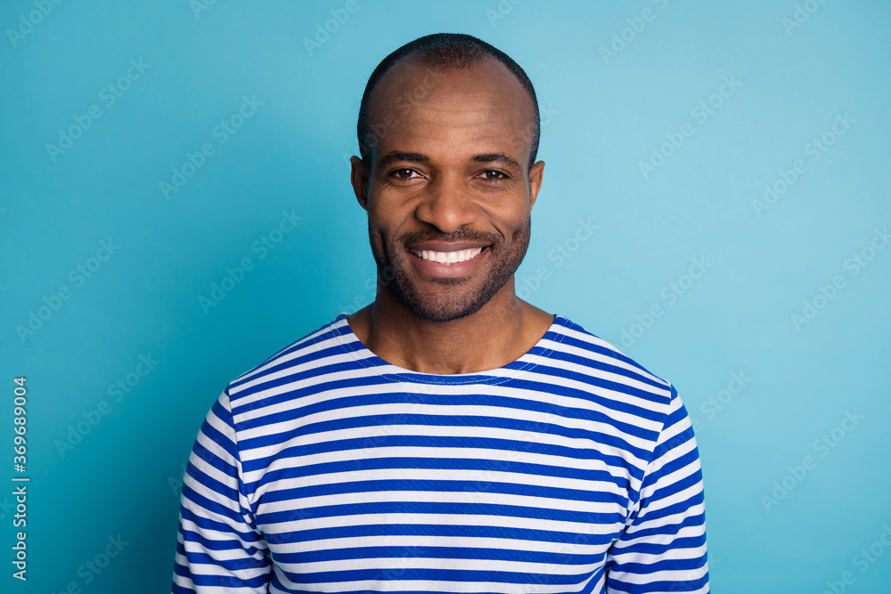 Portrait of candid content dark skin guy enjoy summer holiday walk look ...