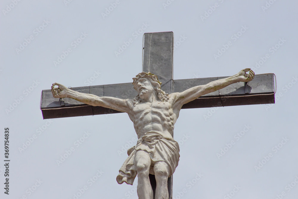 Jesus Christ on the cross in church Stock Photo | Adobe Stock