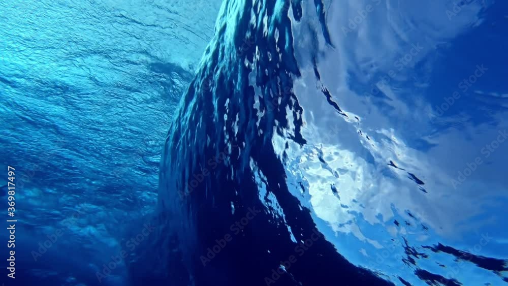Ocean wave. Underwater view of the clear ocean wave breaking over the ...