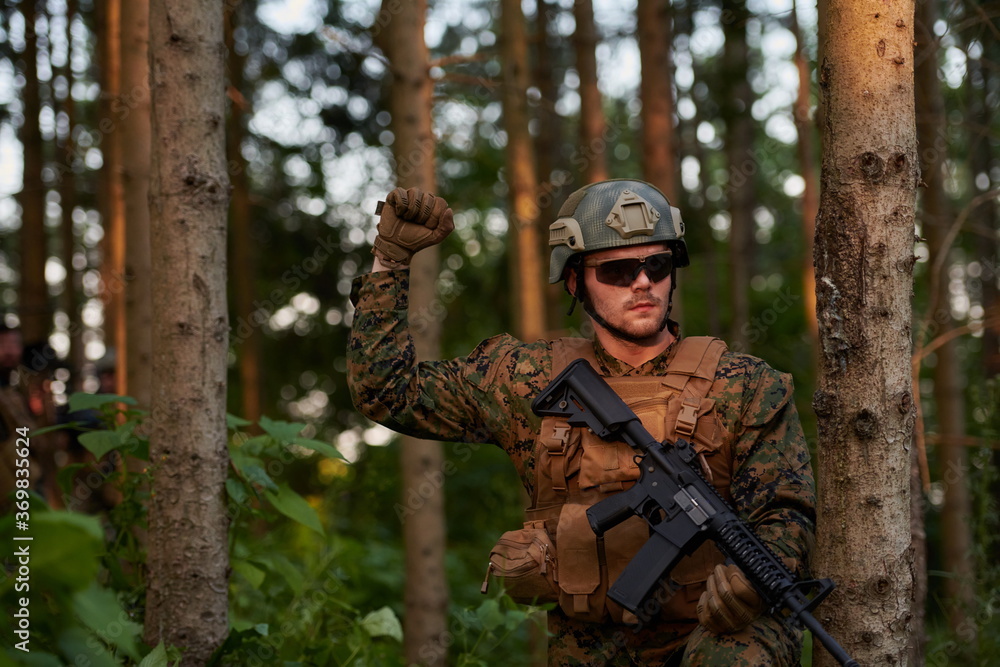 officer is showing tactical hand signals Stock Photo | Adobe Stock