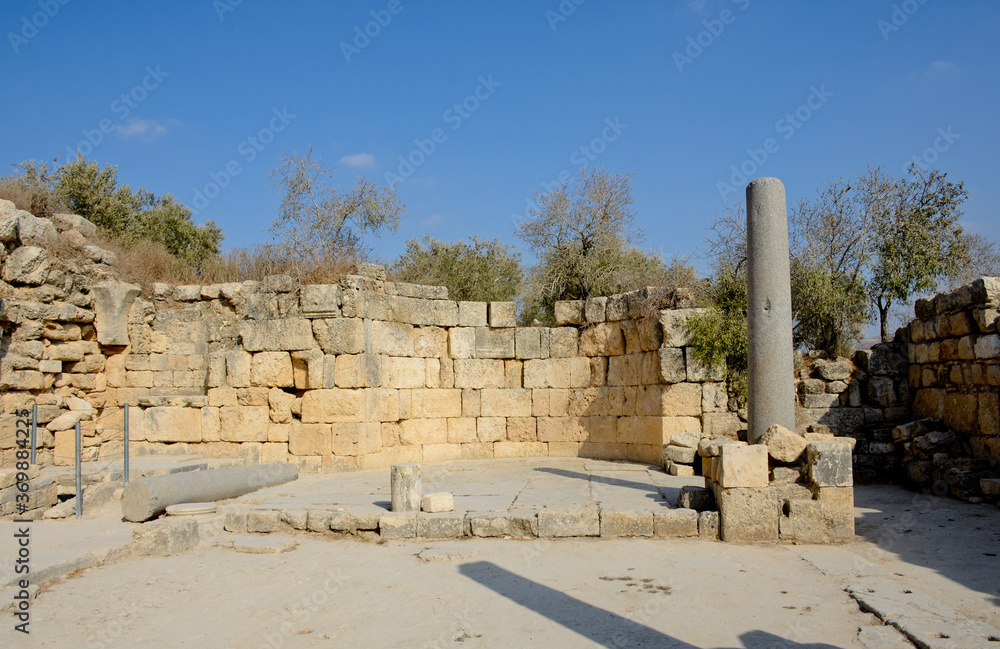 Brick wall of the temple with columns in the middle east. Architectural ...