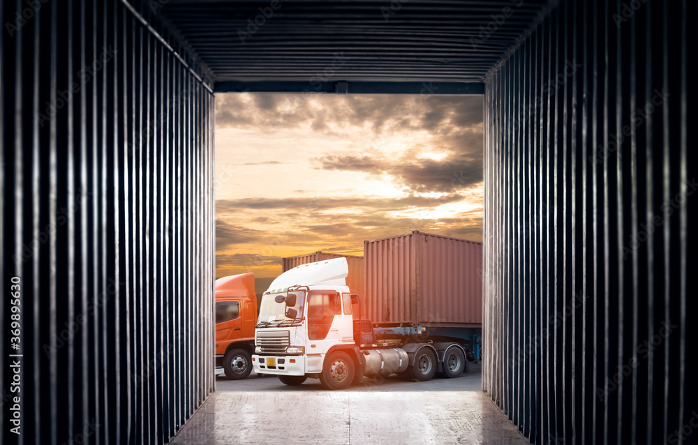 Inside view an empty cargo container with a trailer truck on parking at ...