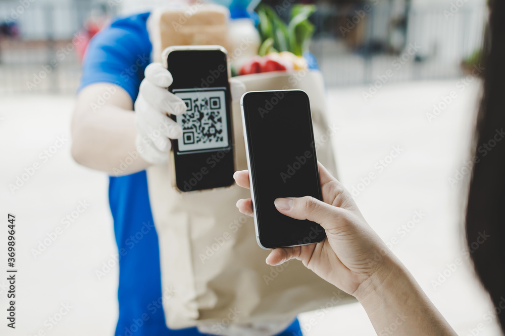 woman customer using digital mobile phone scan QR code paying for ...