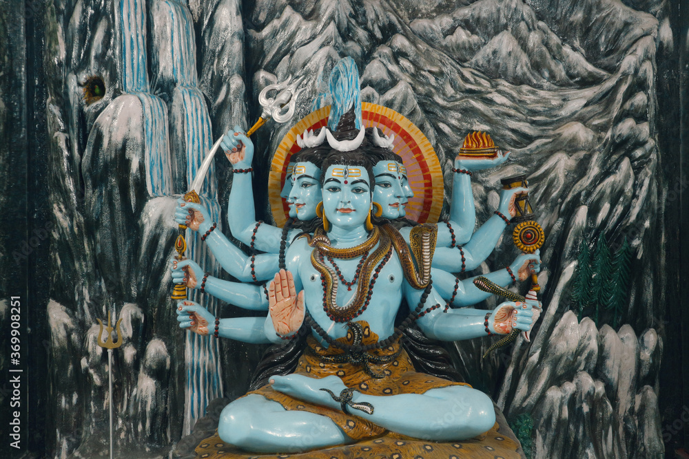The many-headed and multi-armed Lord Shiva. Sculpture of the Indian God ...