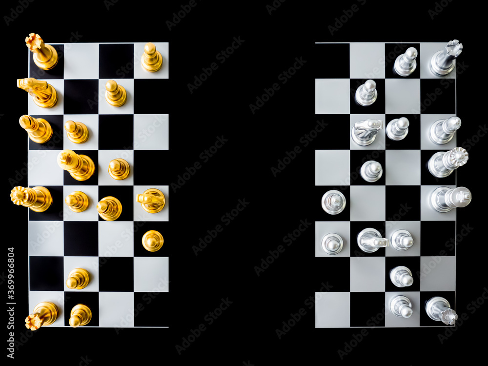 Top view of chess and chessboard is divided in half on a black ...