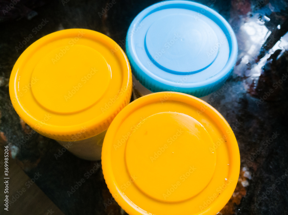 Three containers placed in a table making a triangle shape. Stock Photo ...