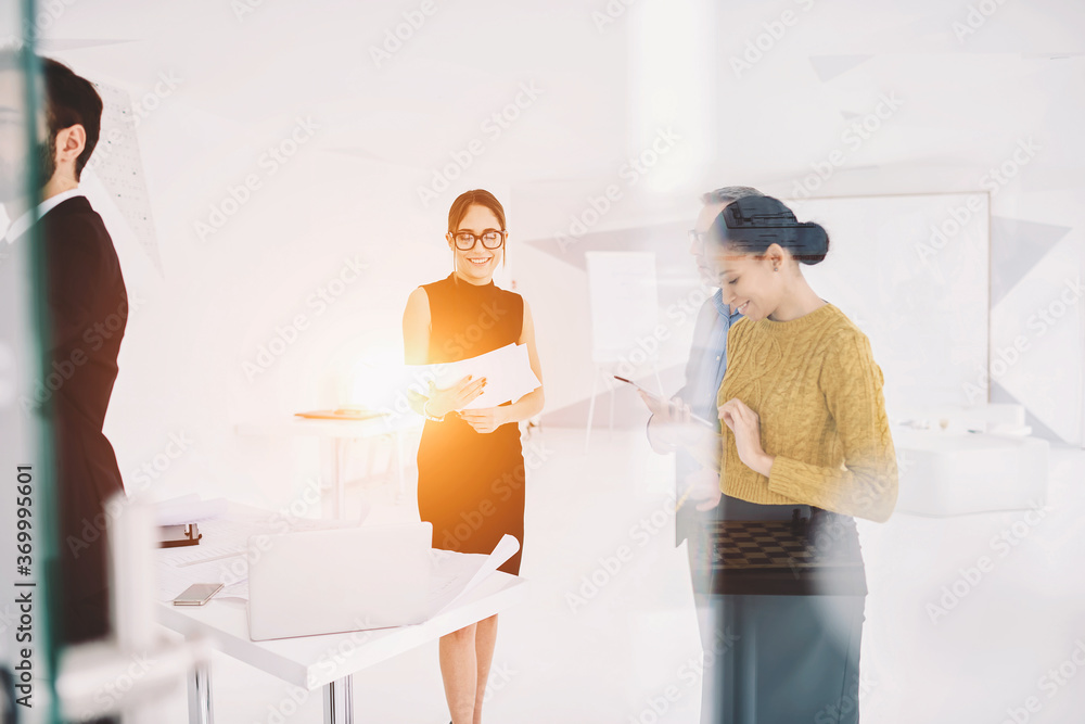Young attractive female secretary dressed in elegant formal outfit and ...