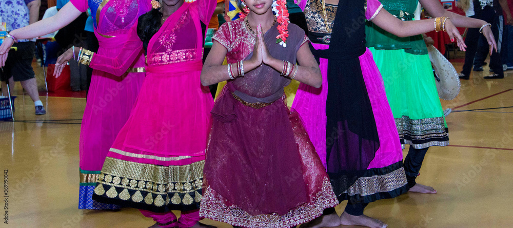 Young Indian girls preforming india dances at a heritage festival ...