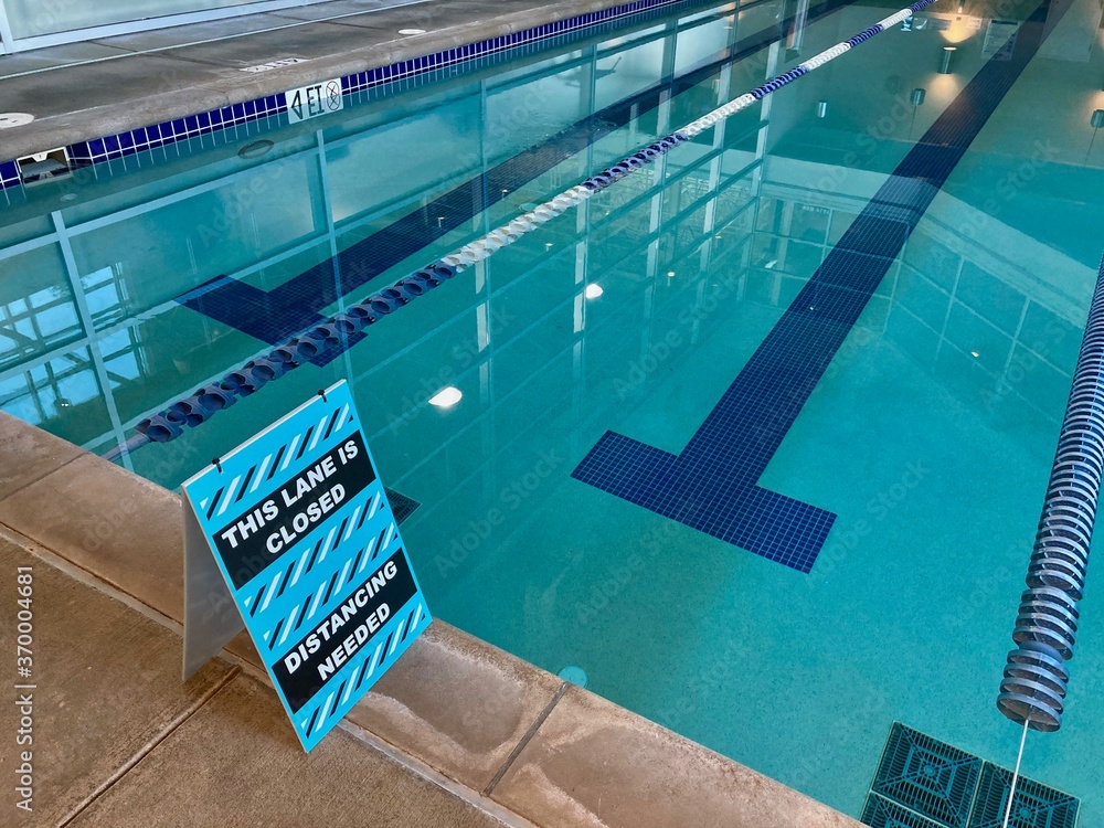 swimming pool with social distancing sign Stock Photo | Adobe Stock