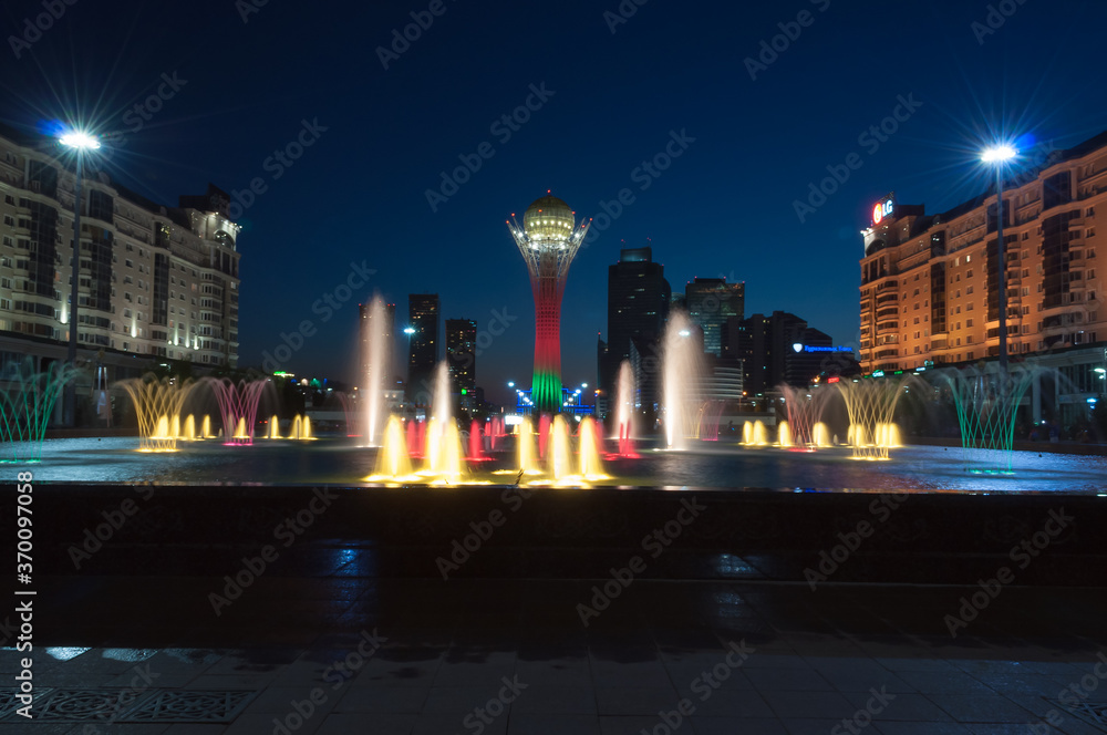 Bayterek Tower and fountain show at night Stock Photo | Adobe Stock