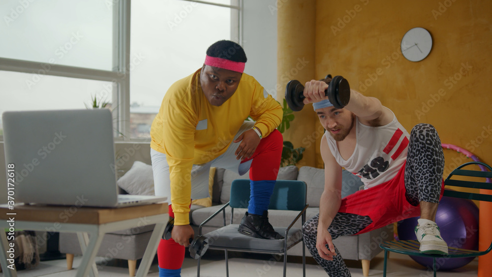 Ridiculous weird couple of fitness beginners doing arm exercises on ...