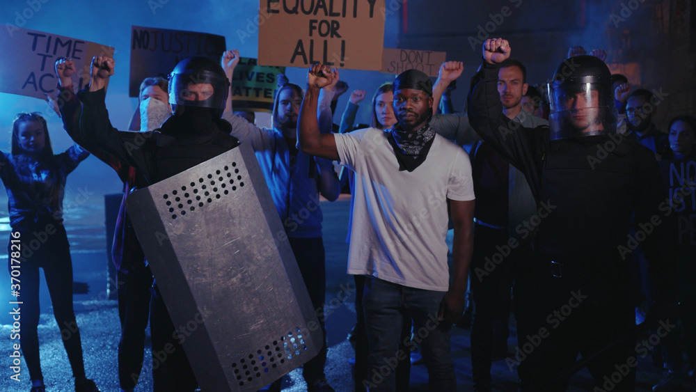 Strong positive crowd of multi-ethnic young activists protest for human ...