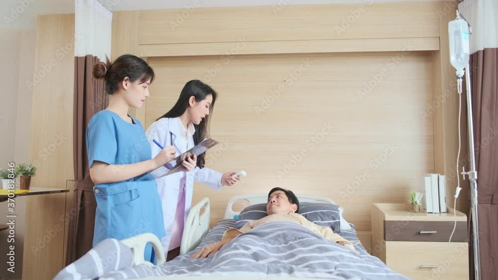 Asian female doctor check using infrared forehead thermometer for ...