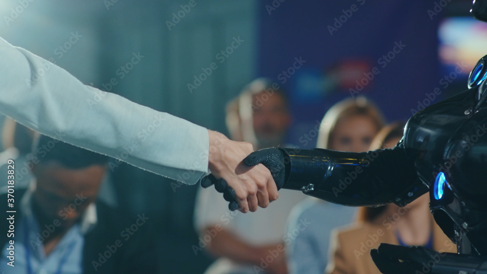 Impressive black business cyborg coach presenting public speech on ...