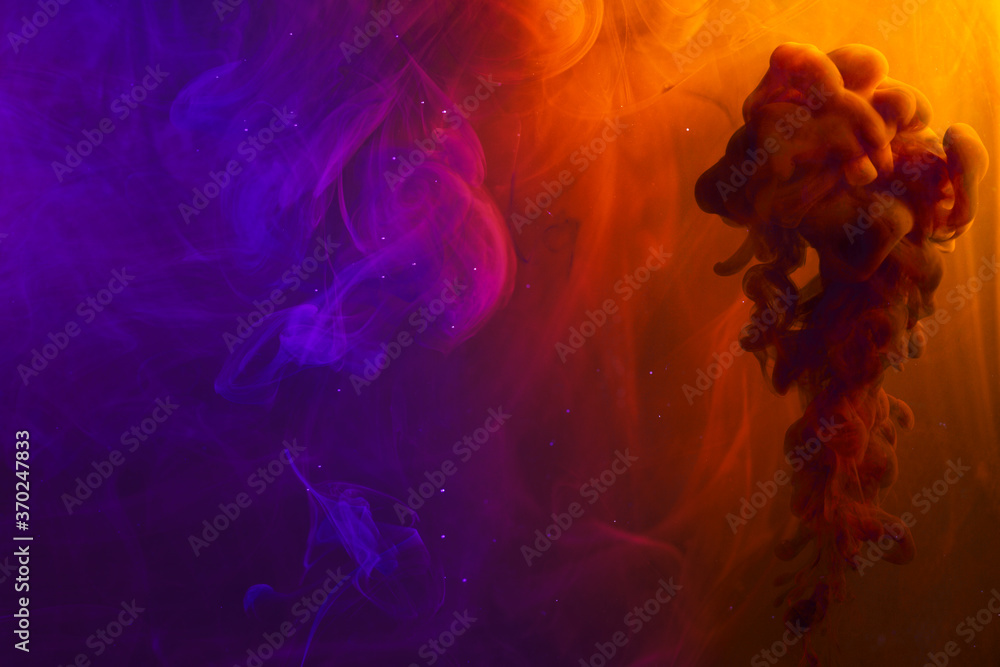 Close-up of purple ink in water on a black background. Stock Photo ...