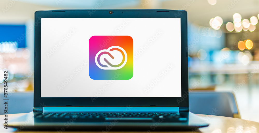 Laptop computer displaying logo of Adobe Creative Cloud Stock Photo ...