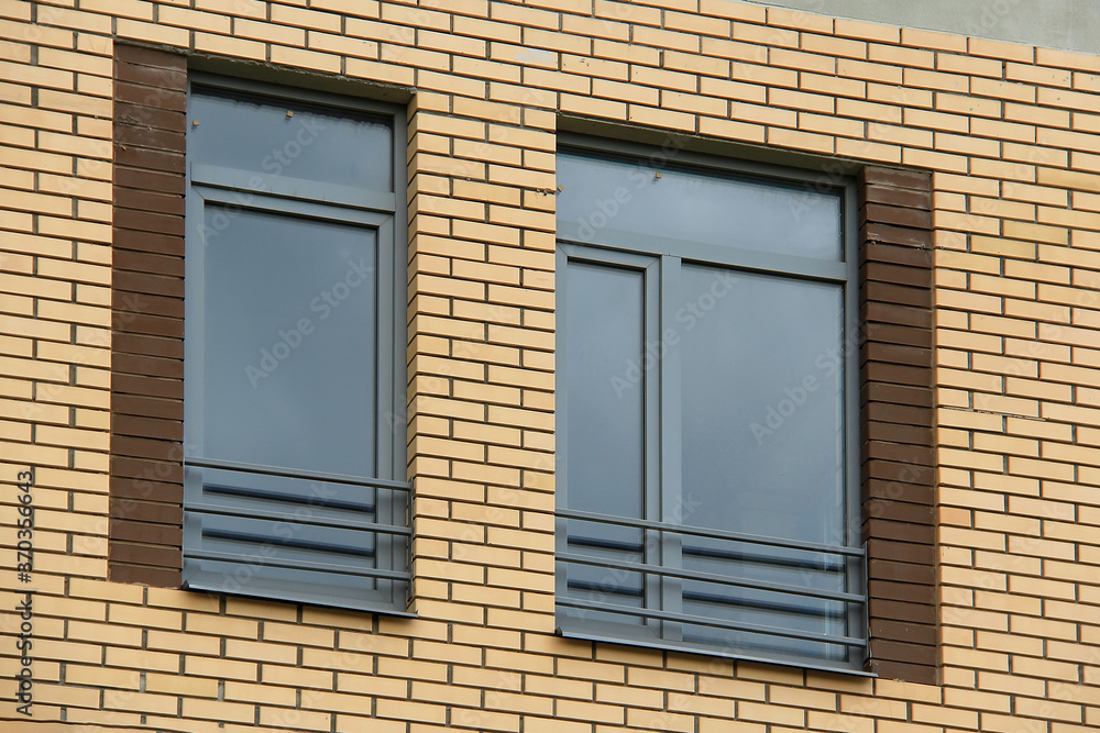 Window on background of brick wall of residential building. Insulated ...