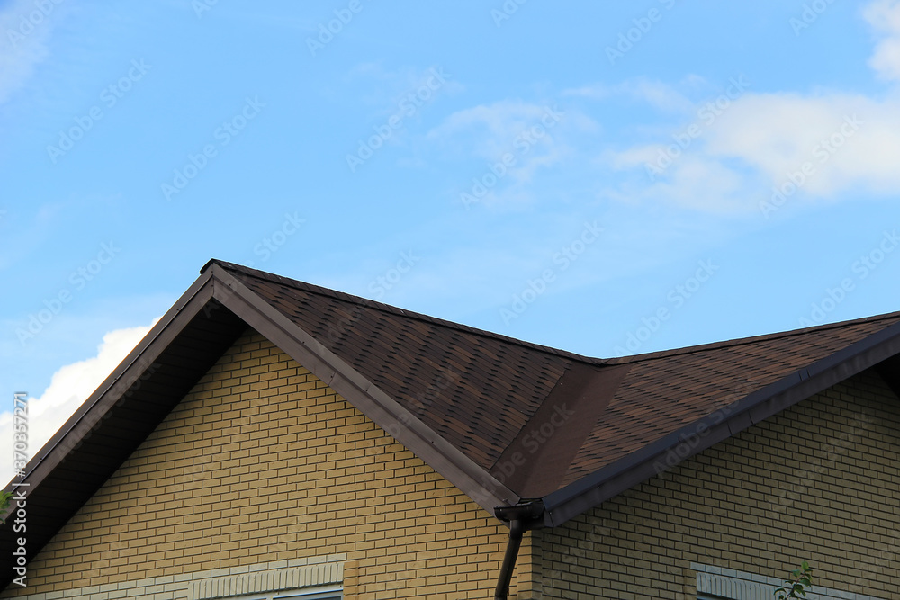 icon roof with new brown roofing tiles on residential property. banner ...