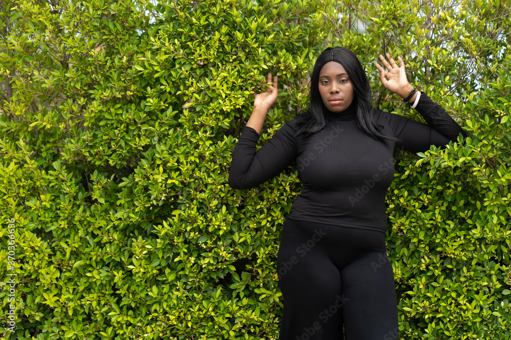 Portrait of Beautiful African fat woman standing outdoor. Black People ...
