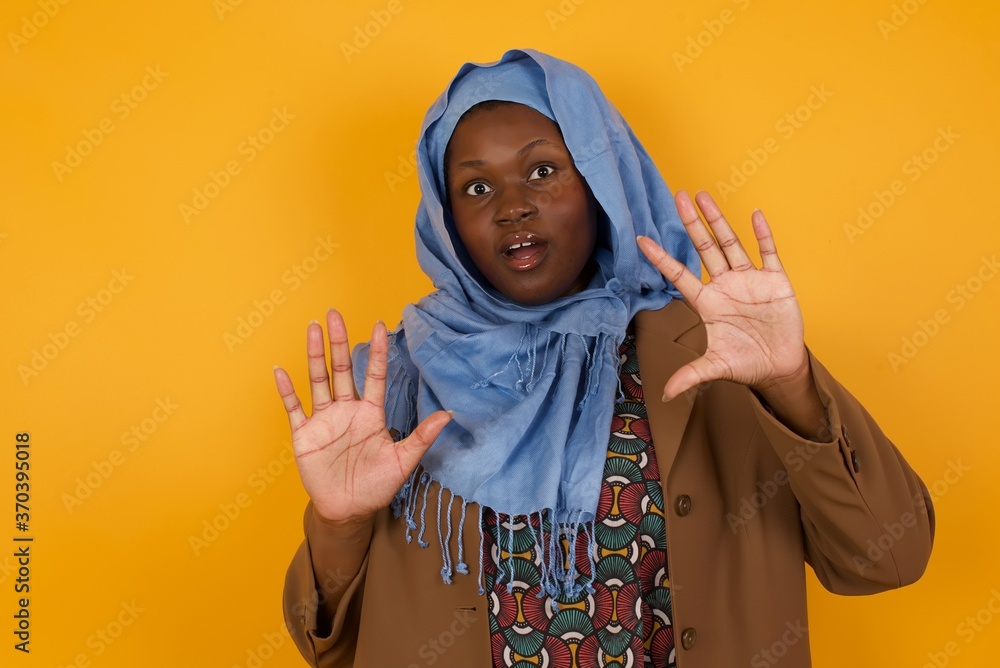 Dissatisfied female model frowns face, has disgusting expression, shows ...