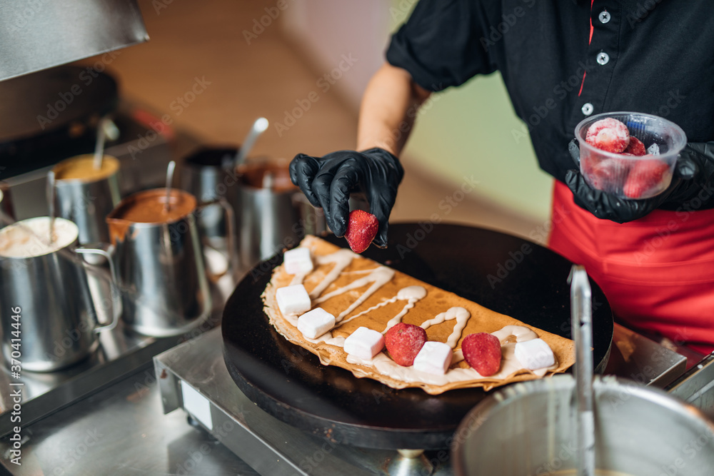 Beautiful and positive brunette woman smiling and working in handmade ...