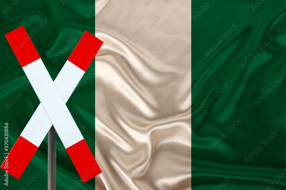 sign, stop, attention on the background of the silk national flag of ...