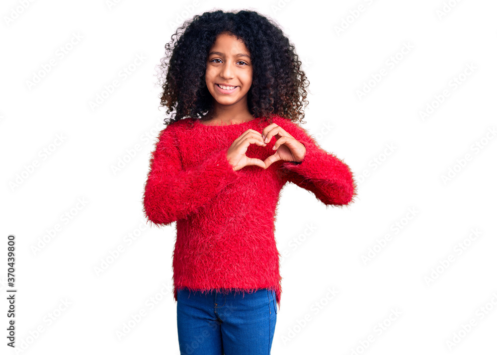 African american child with curly hair wearing casual winter sweater ...