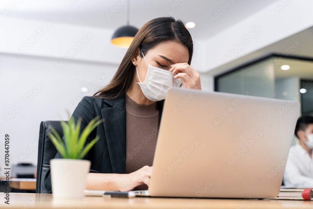 Sickness syndrome in office, Asian young businesswoman working on ...