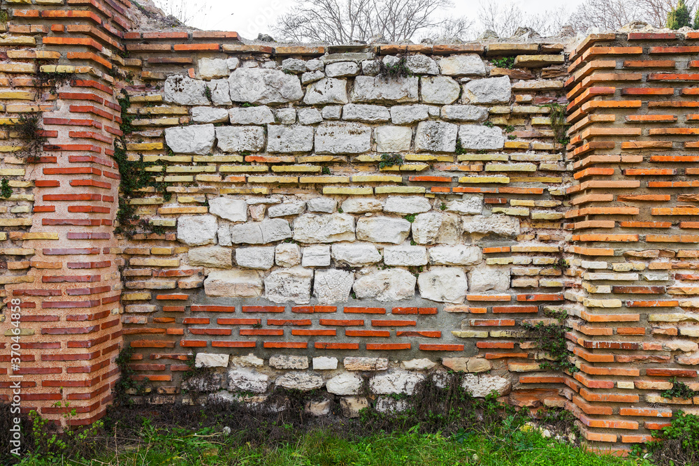 Old building falling apart with broken windows, walls covered with ...